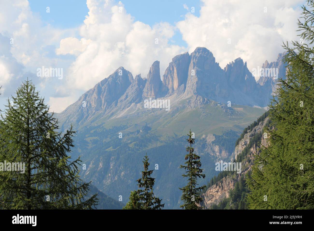 The view of the peaks of the Langkofel or Sassolungo Group seen through ...