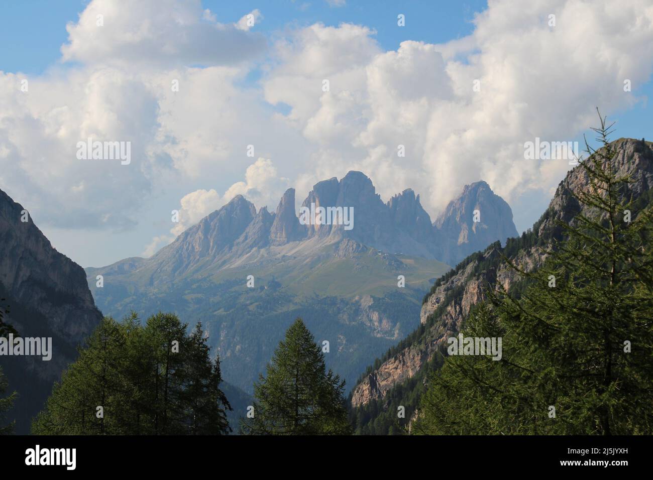 The view of the peaks of the Langkofel or Sassolungo Group seen through ...