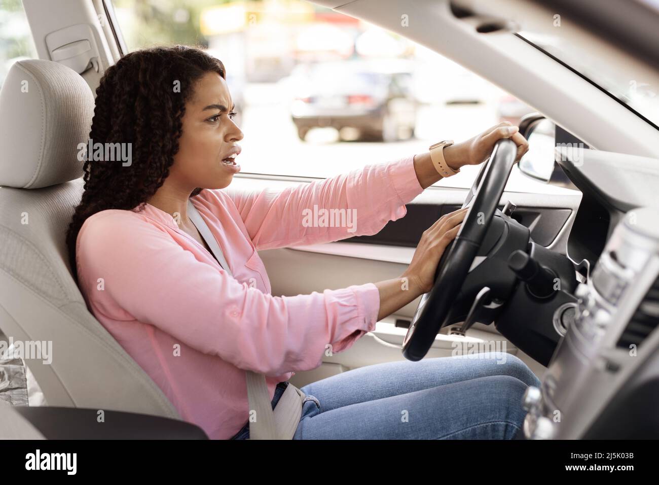 Angry black woman driving car shouting and honking Stock Photo - Alamy