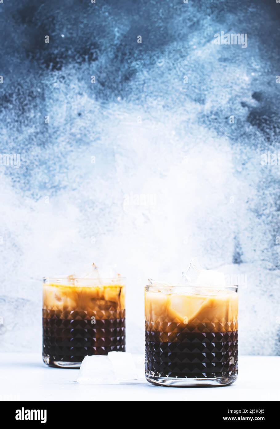 Trendy alcoholic cocktail drink with vodka, coffee liqueur, cream and ...