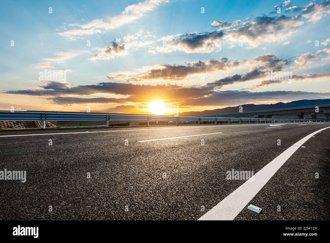 Asphalt highway and beautiful sky cloud landscape at sunset. Road and ...