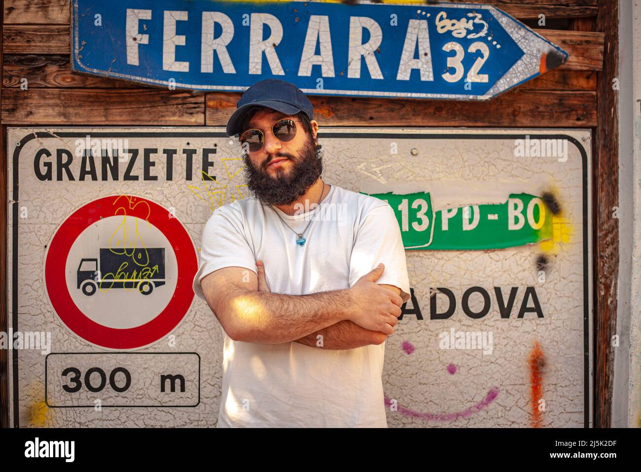 Man with beard portrait and road signs behind Stock Photo - Alamy