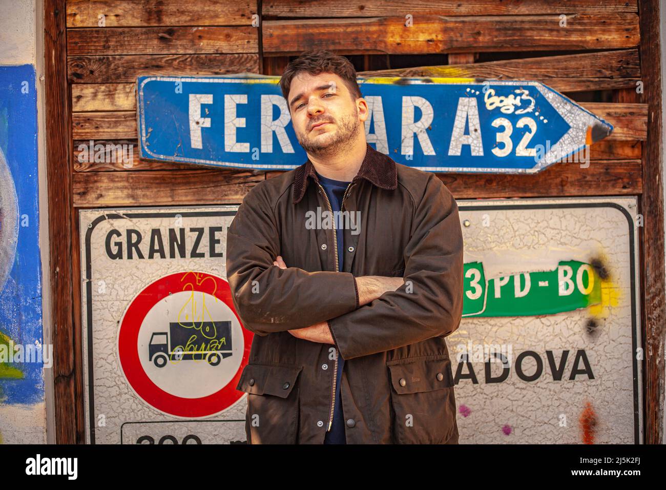 Boy portrait with road signs behind Stock Photo - Alamy