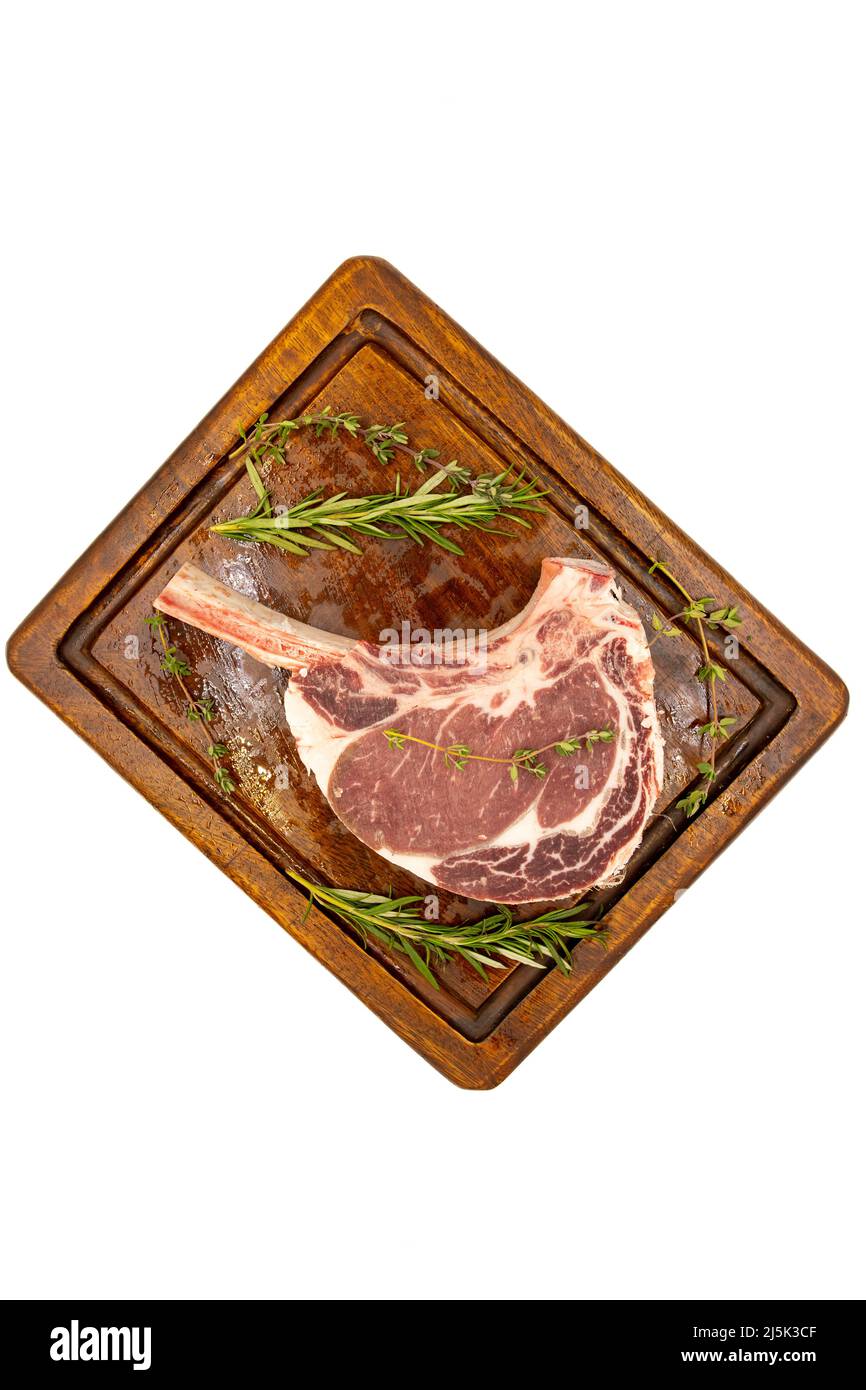Raw Veal chop isolated on white background. Raw veal chop on wooden ...