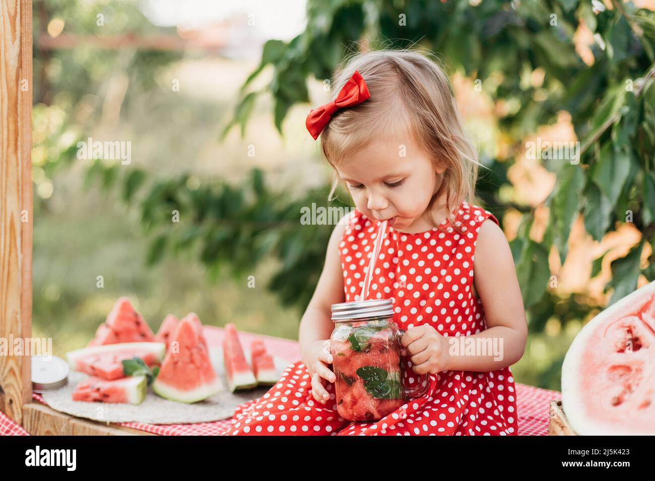 Lemonade Stand. Adorable little girl trying to sell lemonade ...