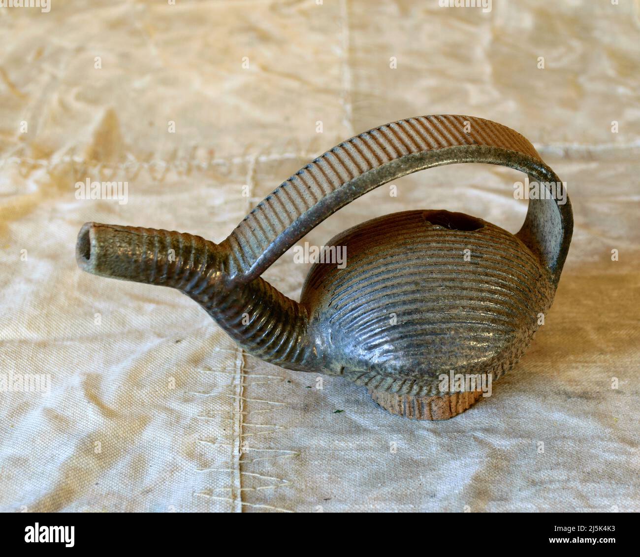 decorative clay mug, crumpled fabric background, handmade, still life ...