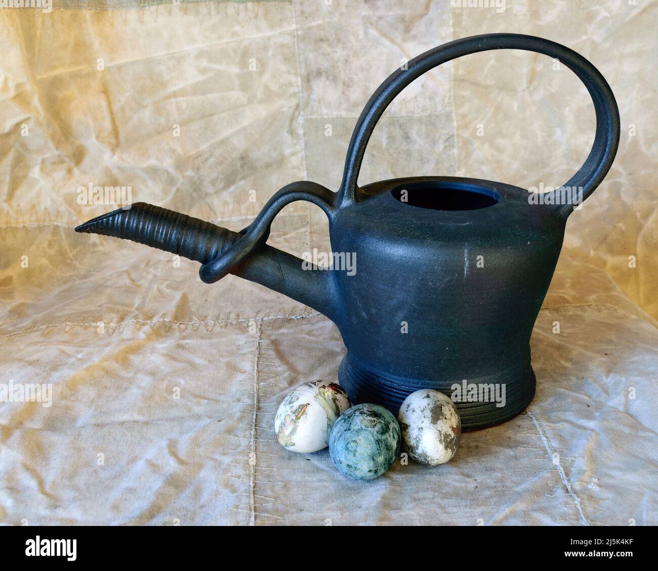 decorative clay mug, crumpled fabric background, handmade, still life ...