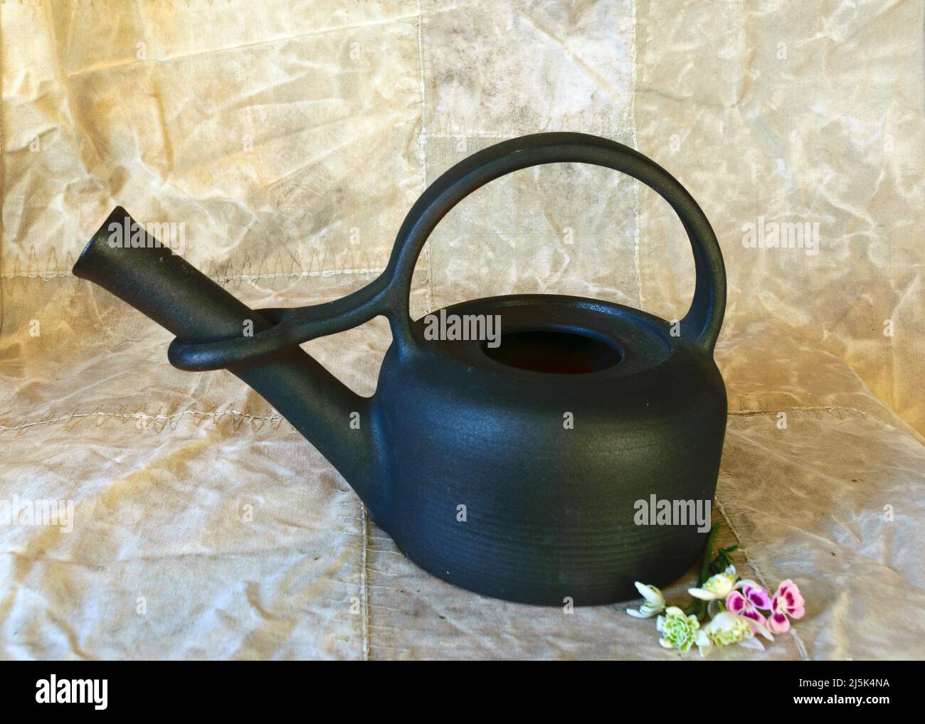 decorative clay mug, crumpled fabric background, handmade, still life ...