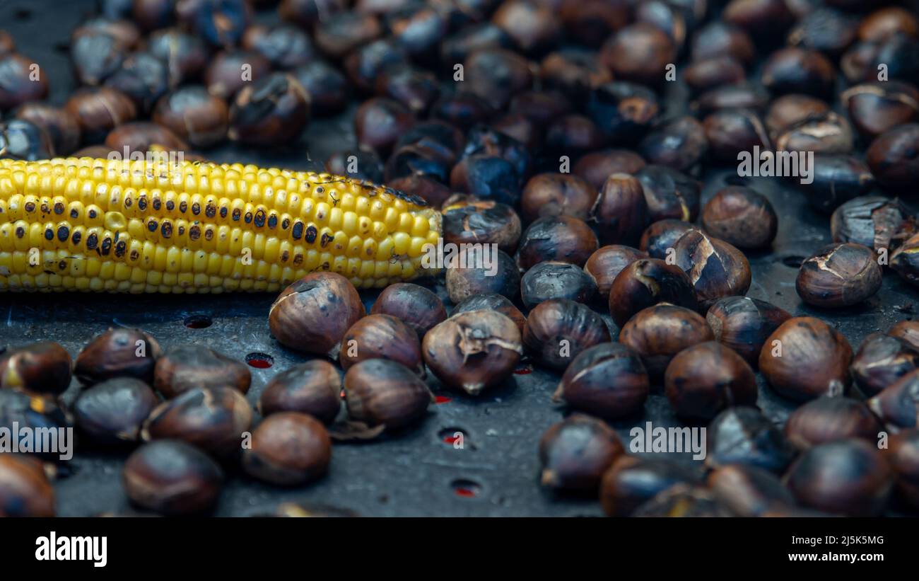 Grilled chestnut and cob. Barbecue with charcoal fire Stock Photo - Alamy