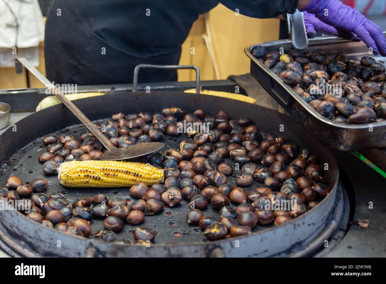 Chestnut and corn cob cooking on the barbecue with charcoal Stock Photo ...