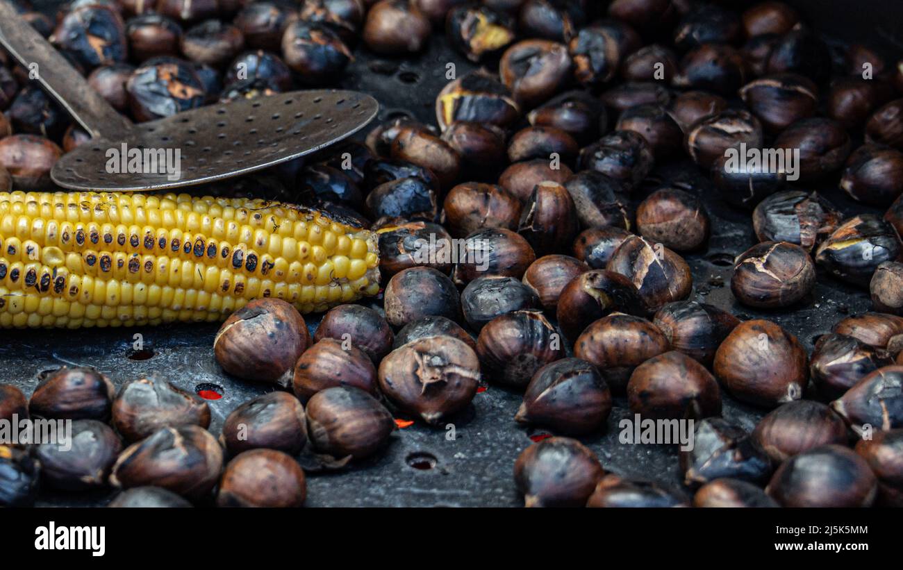 Grilled chestnut and cob. Barbecue with charcoal fire Stock Photo - Alamy