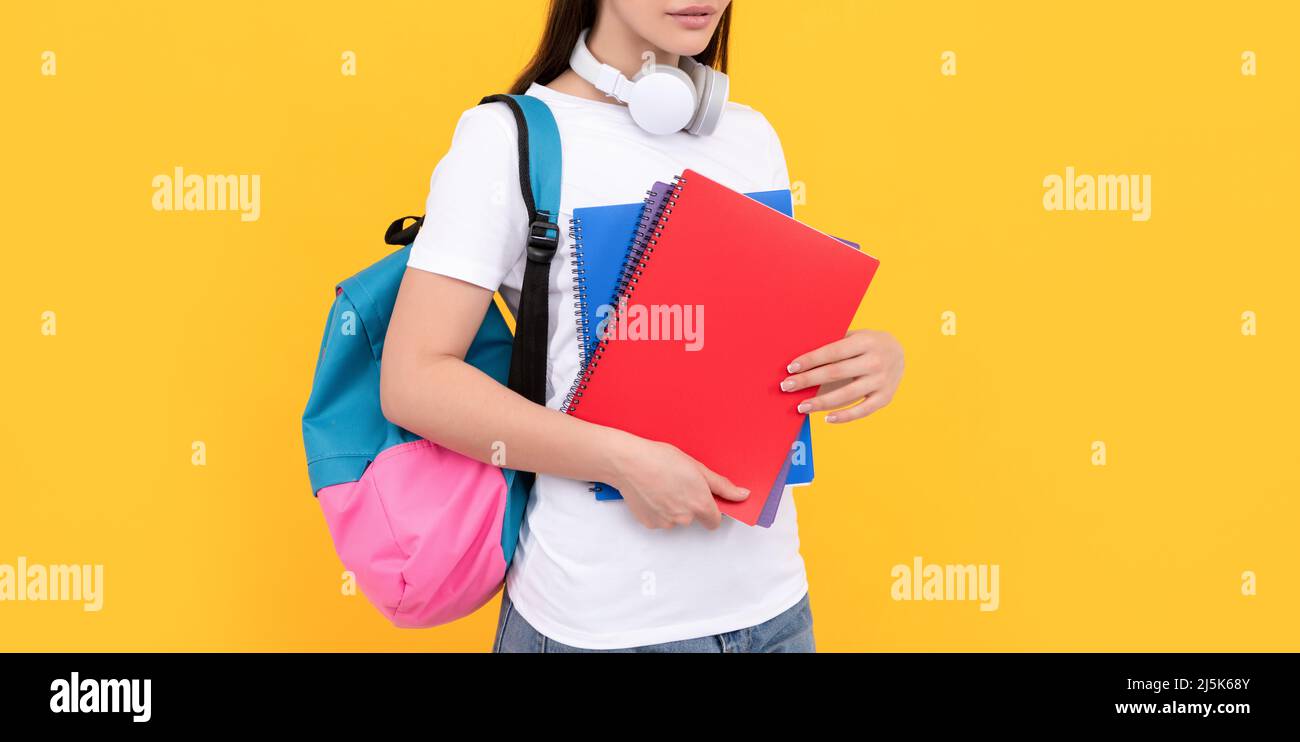student hold notebook. girl holding notebook on yellow background ...