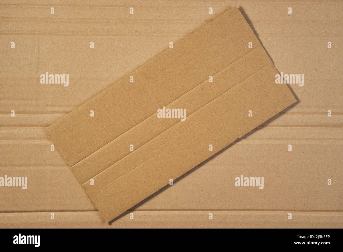 Recycled wrapping kraft paper with blank address card. Empty brown ...