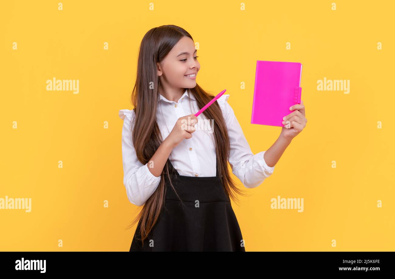 Learn to write. Happy kid point pen at book. School education. Starting ...