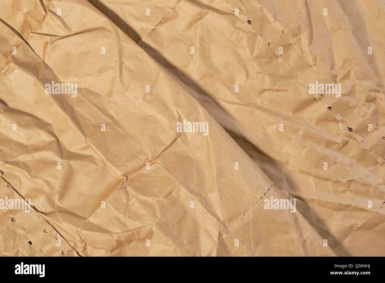 Wrapping paper crease. Wrinkled brown texture. Crumpled abstract ...