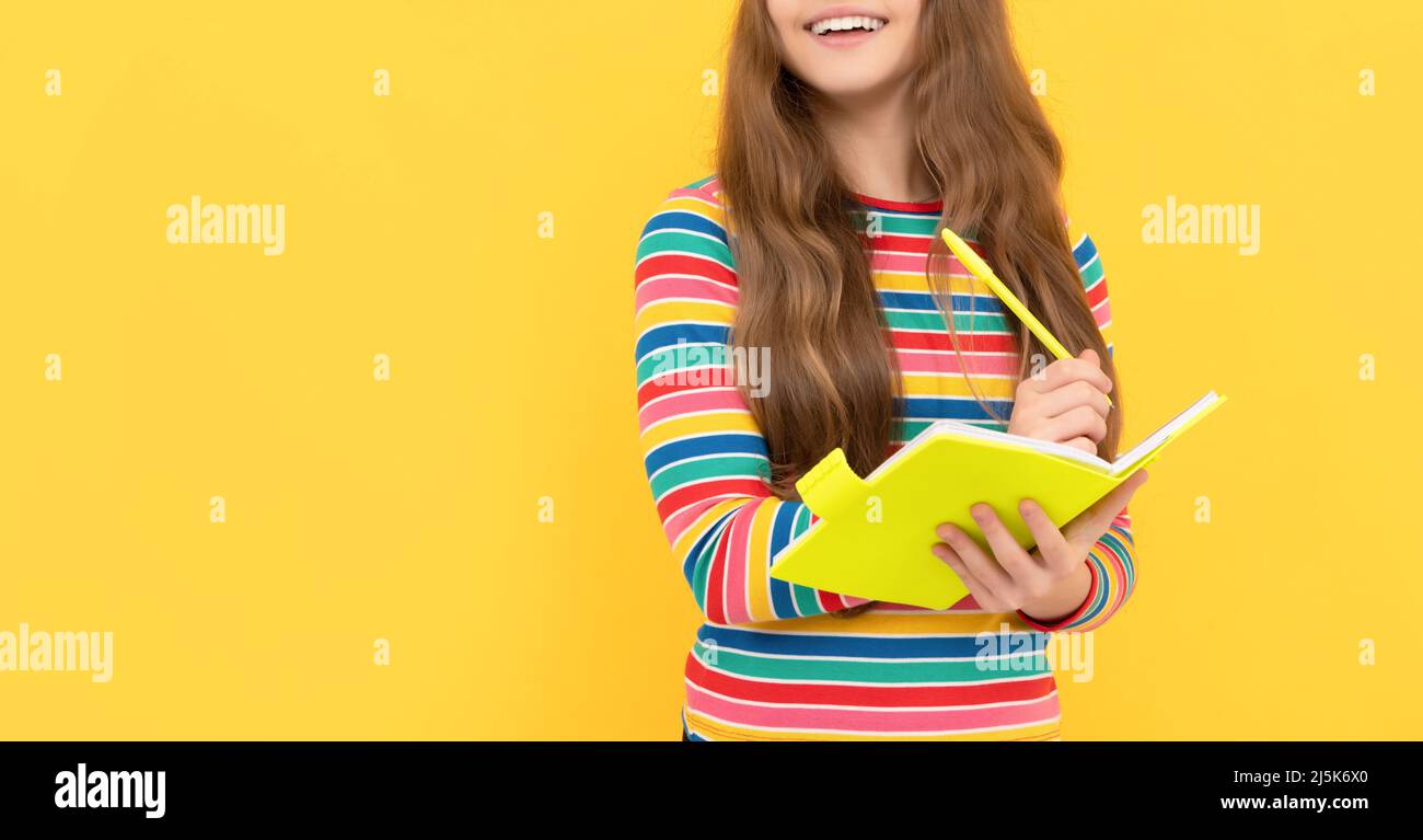 Happy school kid learn to write with eyes closed yellow background ...