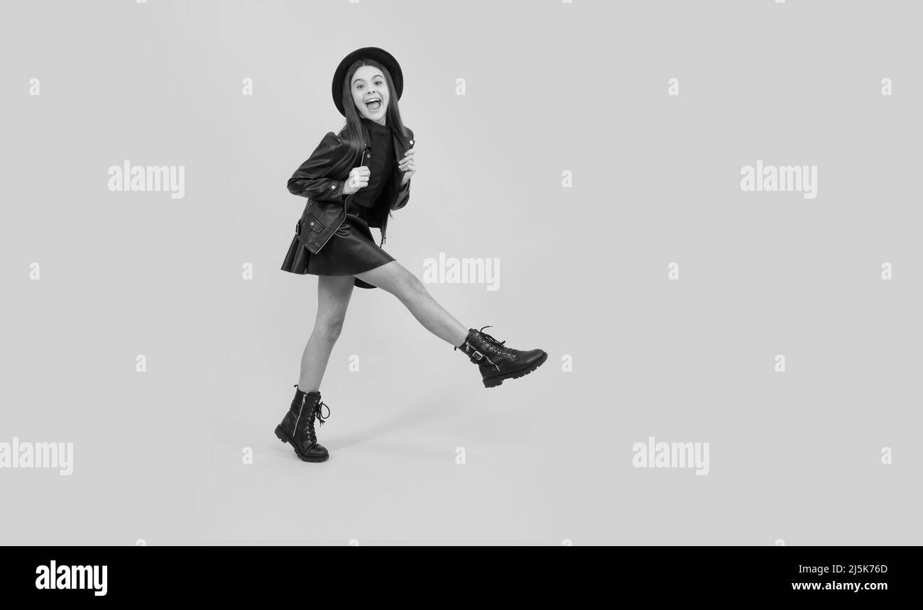 dancing stylish teen child making wide step. kid in hat and boots ...
