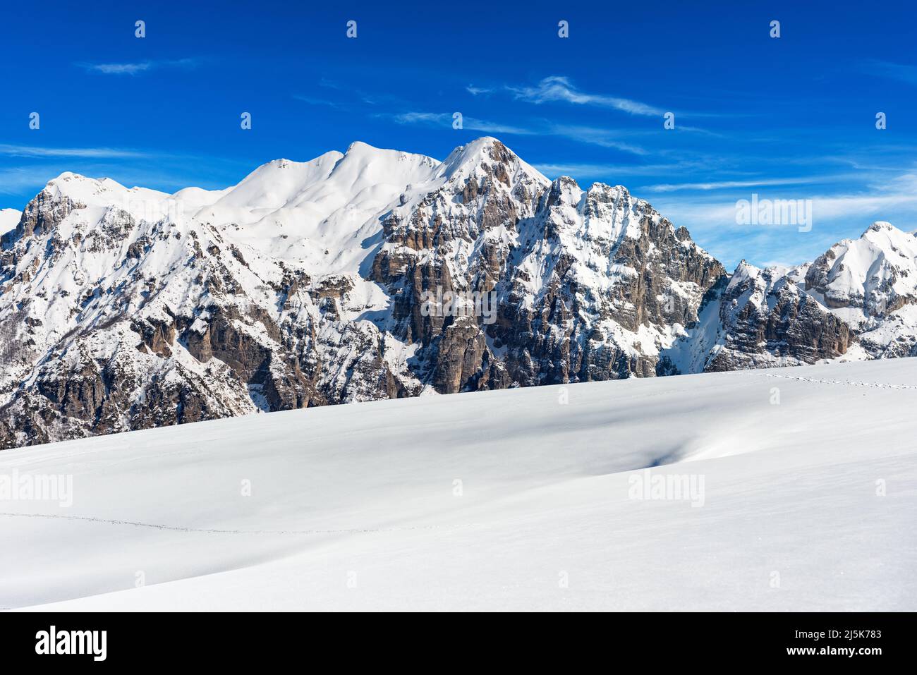 Snow capped mountain peaks in Italian Alps. Mountain range of Monte ...