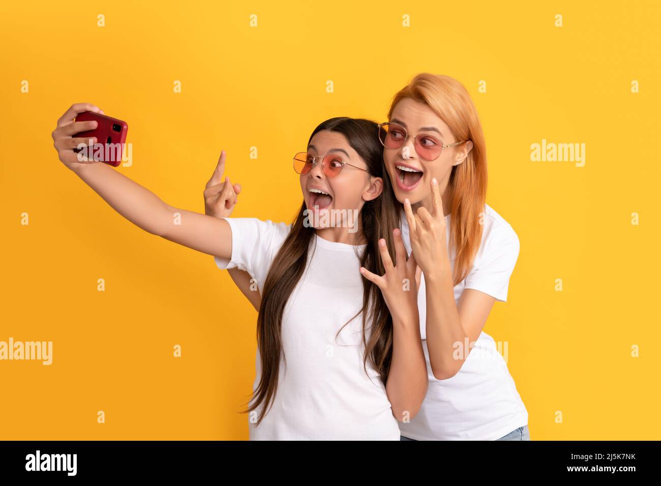 mother and daughter vlogging. online communication. mom and kid ...