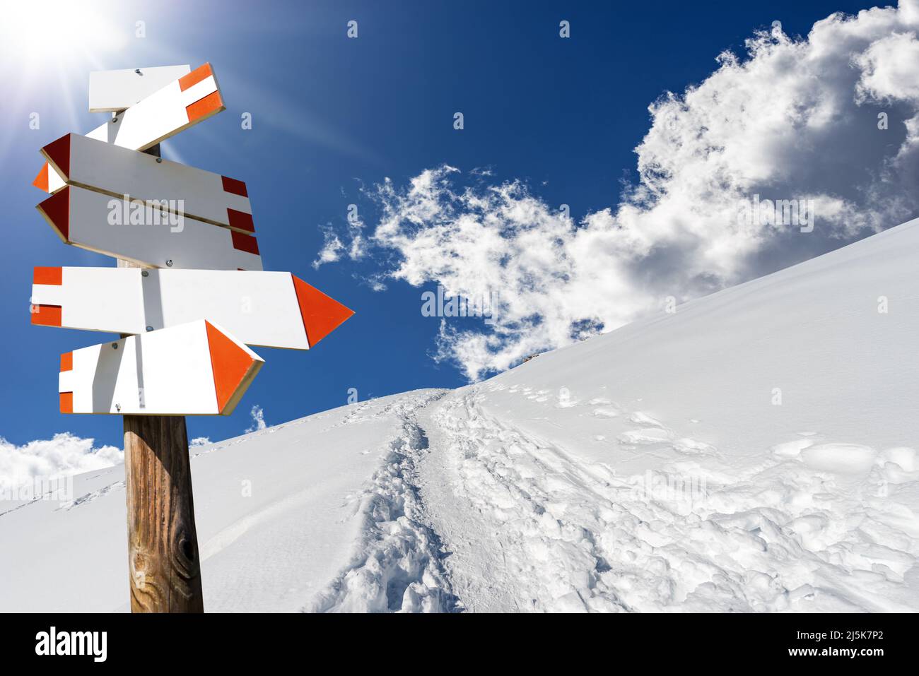 Blank directional trail signs in a beautiful winter mountain landscape ...