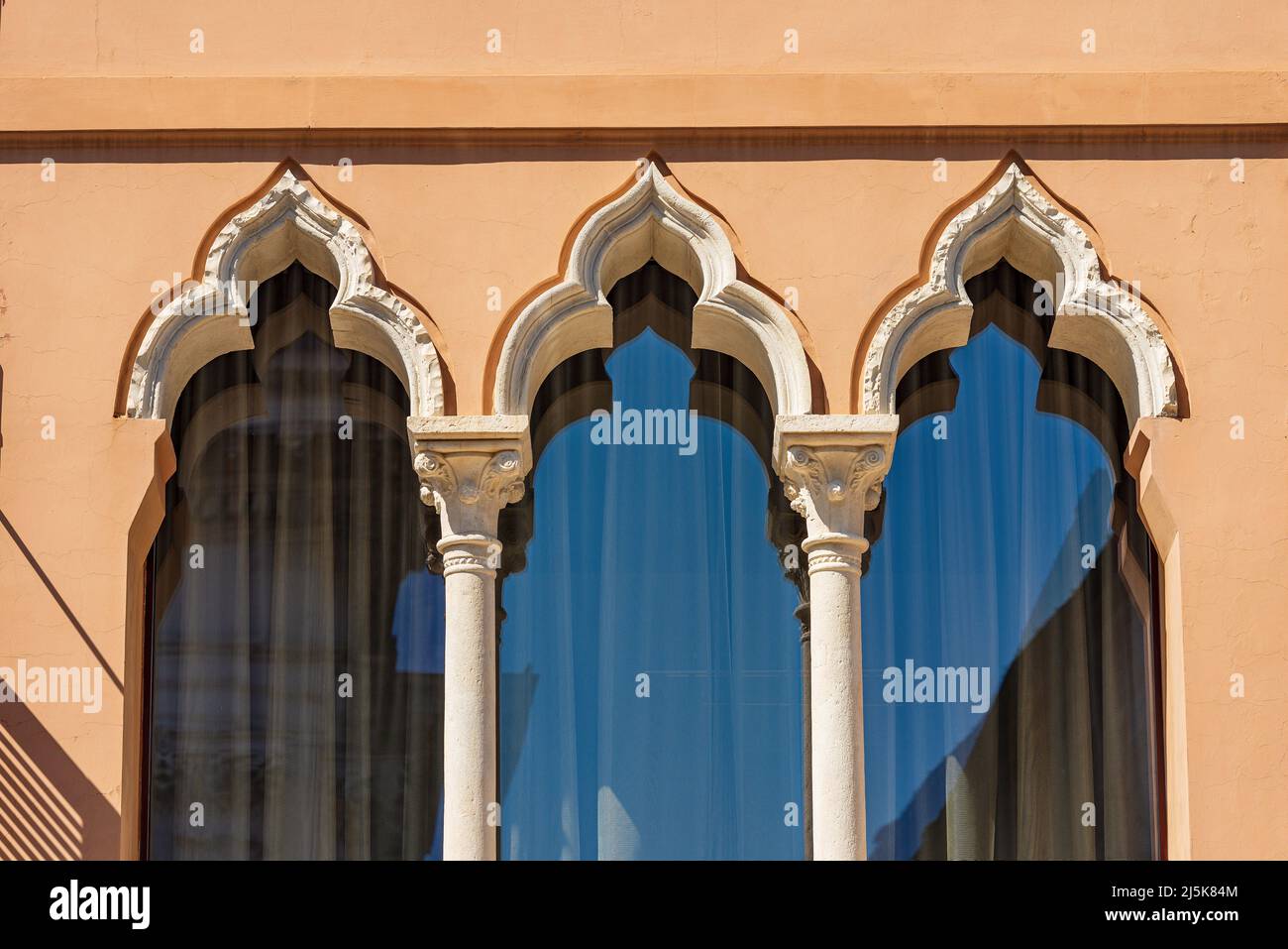 Ancient windows with arch in Venetian Gothic style and stone ...