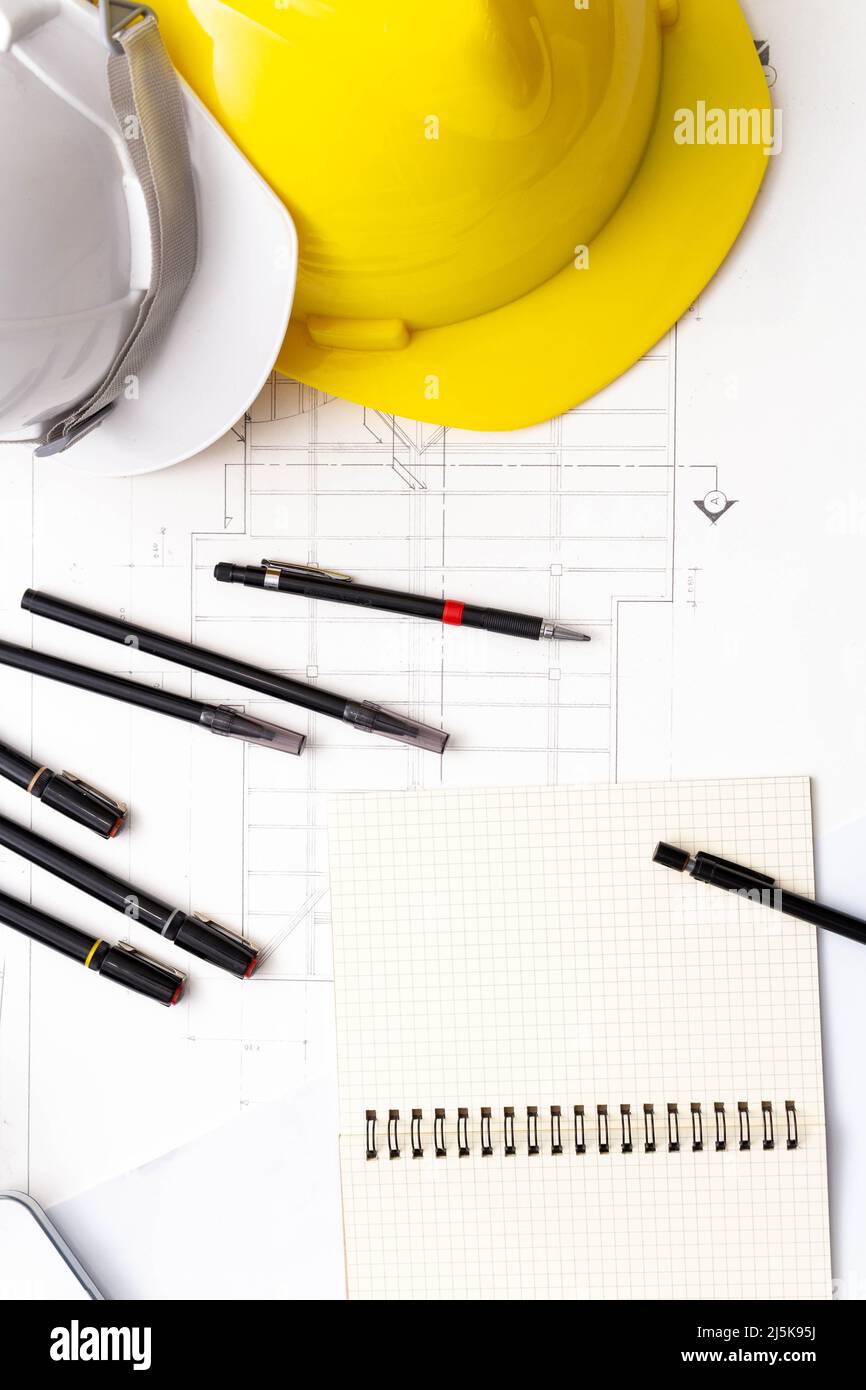 Mockup of architectural concept, Drawing tools and safety helmet on ...