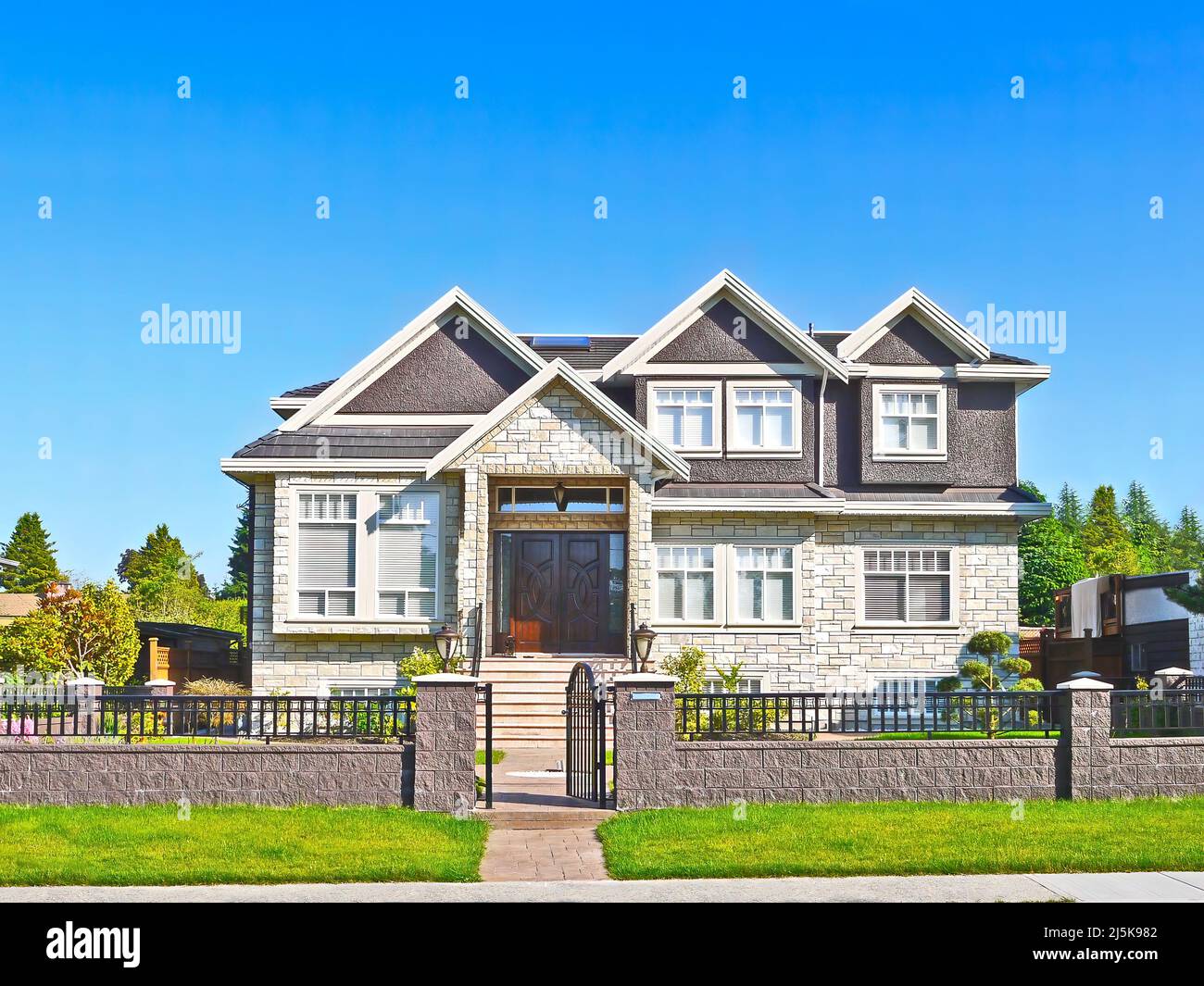 Nice and neat residential house with concrete pathway in the front ...