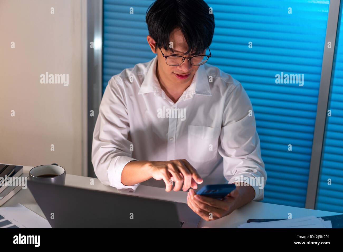 Overwork Concept The male office employee who wears white blazer ...