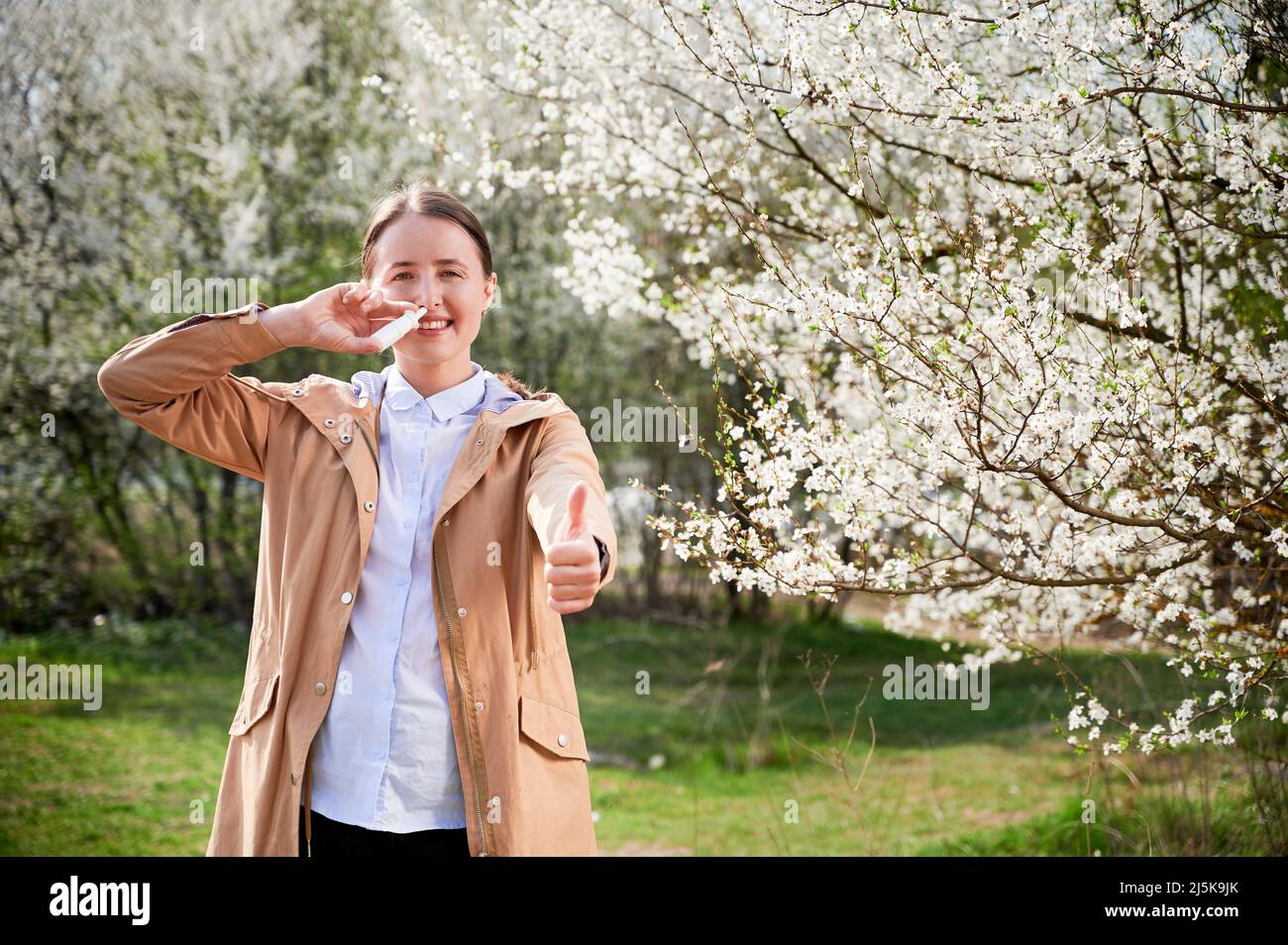 Woman allergic suffering from seasonal allergy at spring, posing in ...