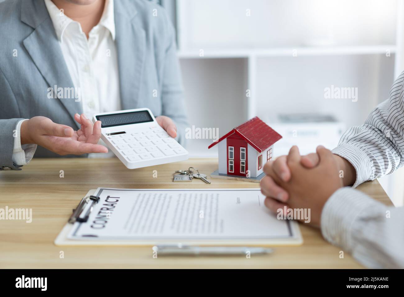 The selling agent informing his client about the expense by showing it ...
