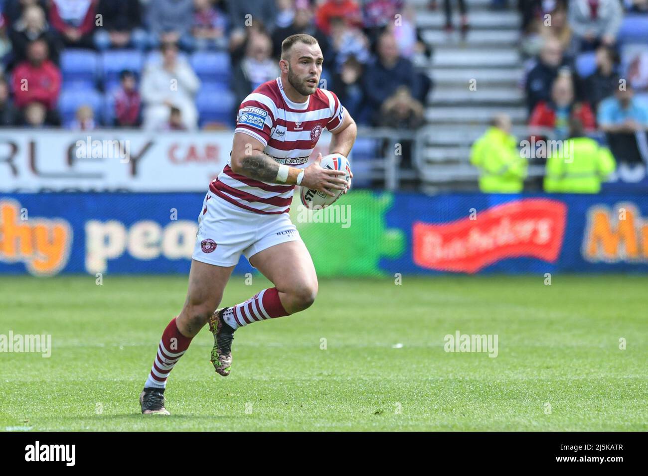 Kaide Ellis #15 of Wigan Warriors runs forward with the ball Stock ...