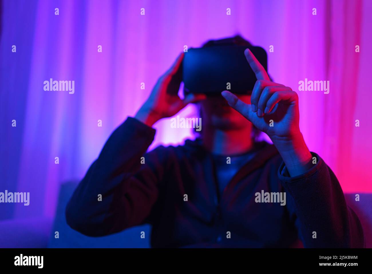 Metaverse technology concept, Man holding VR goggles and pointing to ...