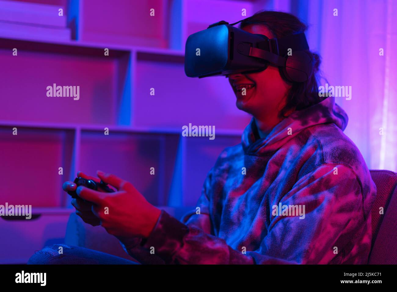 Metaverse technology concept, Man wear VR goggles and using joystick to ...