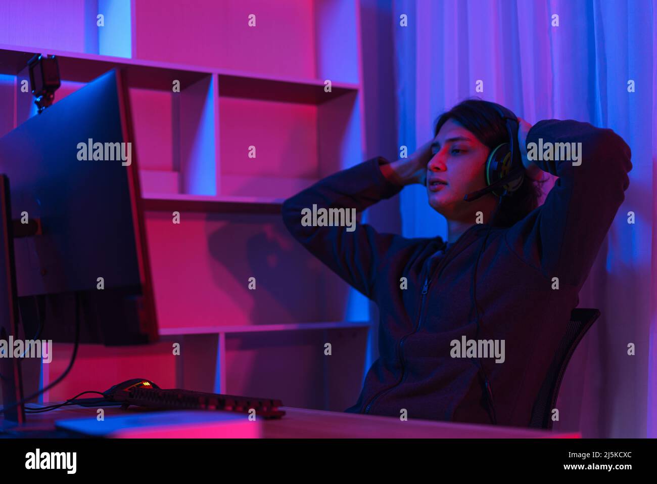 Game stream concept, Male streamer taking a break to rest after live ...