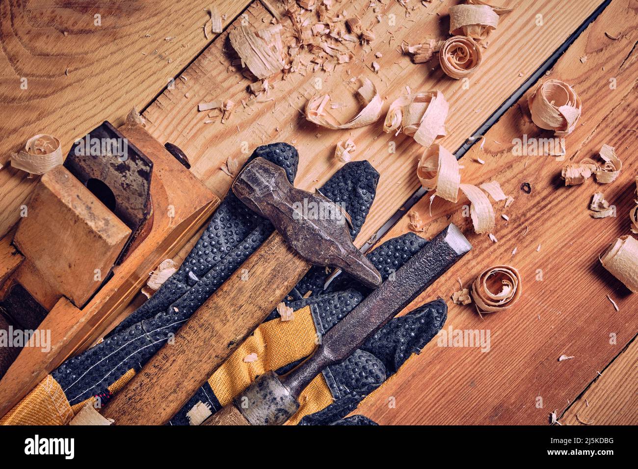 Carpenters tool kit, hammer, chisel and plane with gloves wooden ...