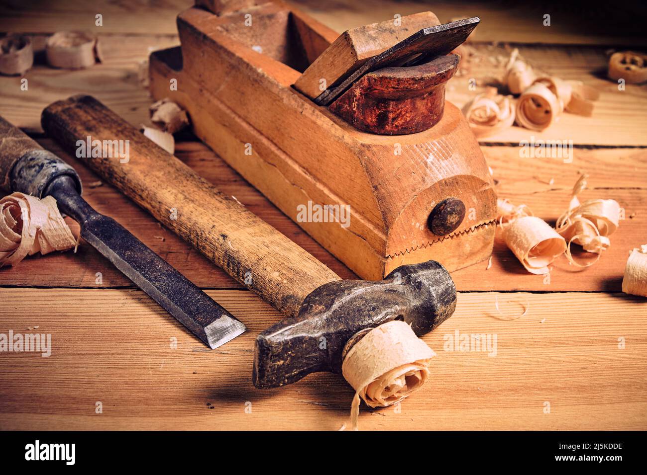 Set of tools for carpenters, hammer, chisel and plane on wooden ...