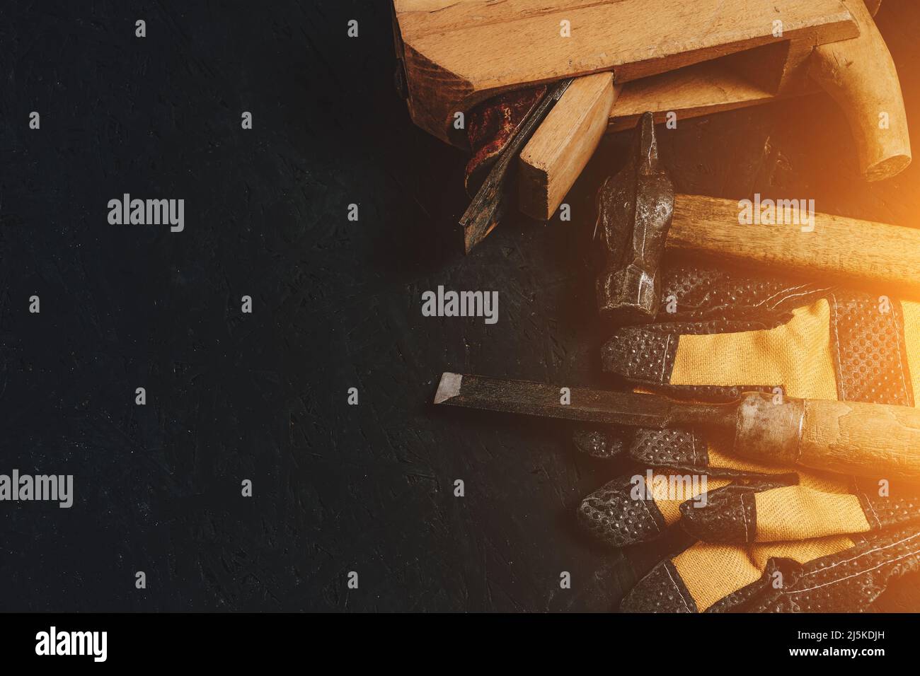 Set of tools for carpenters, hammer, chisel and plane with gloves dark ...