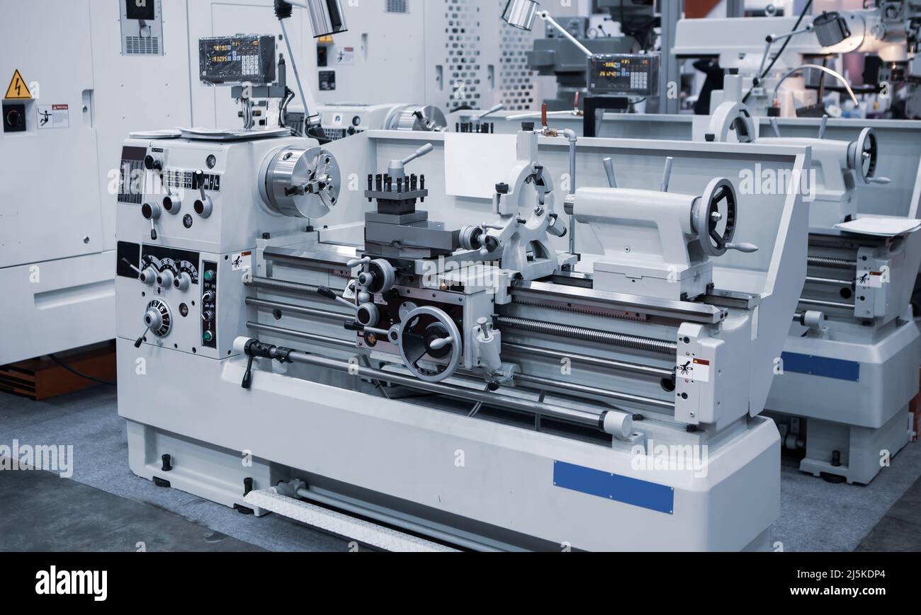 Metalwork workshop. Lathe turning machine in industrial factory Stock ...