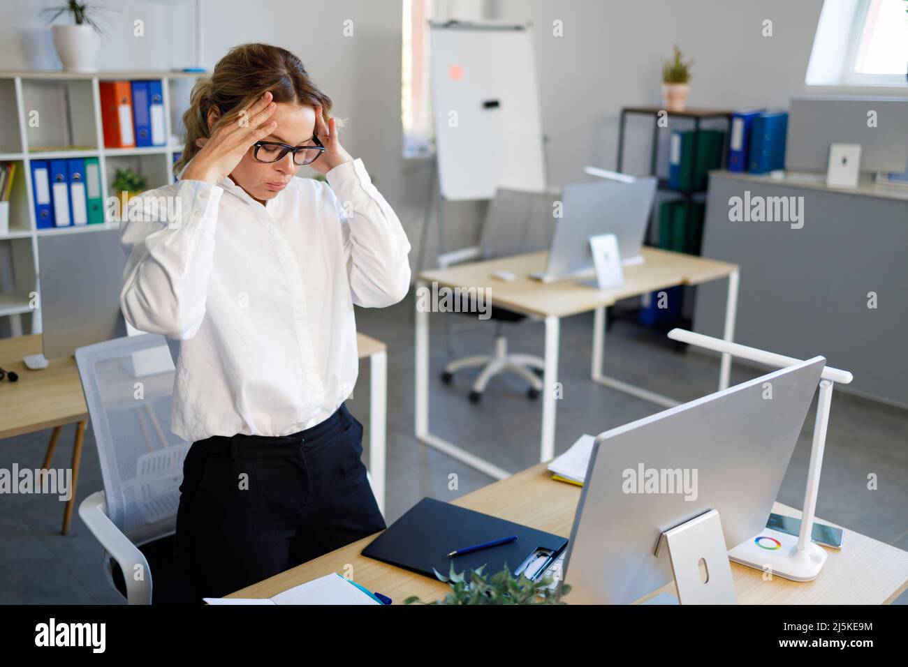 Overworked secretary in office hi-res stock photography and images - Alamy