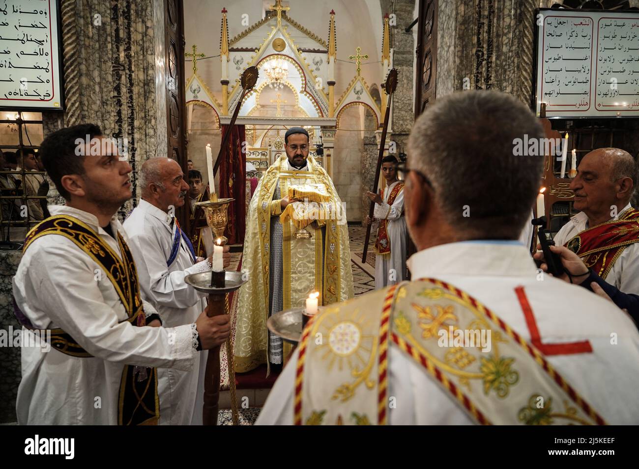 Bartella, Iraq. 24th Apr, 2022. Priests lead the Easter Mass of Syriac ...