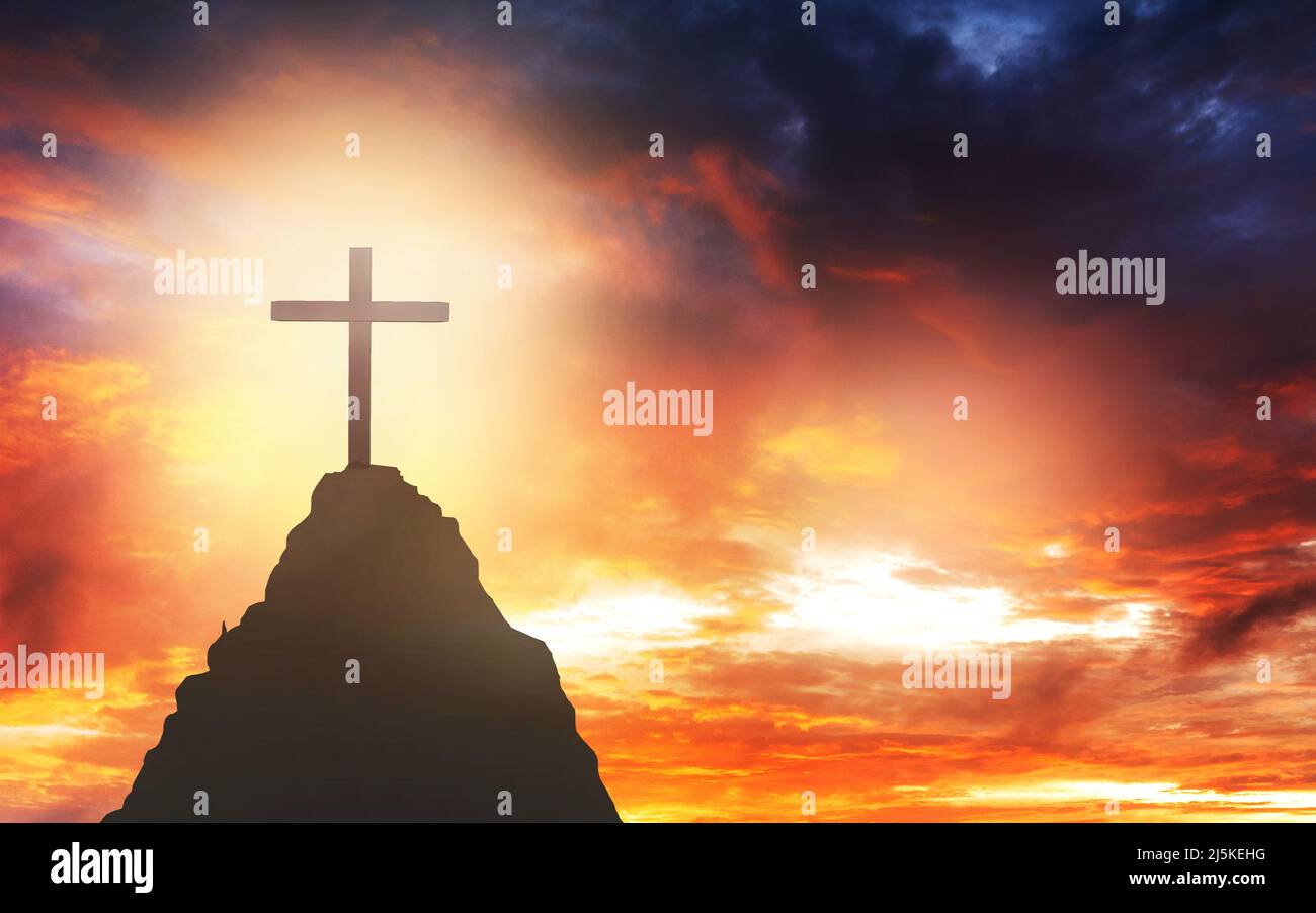 Silhouette Jesus and the cross over sunset on mountain top Stock Photo ...