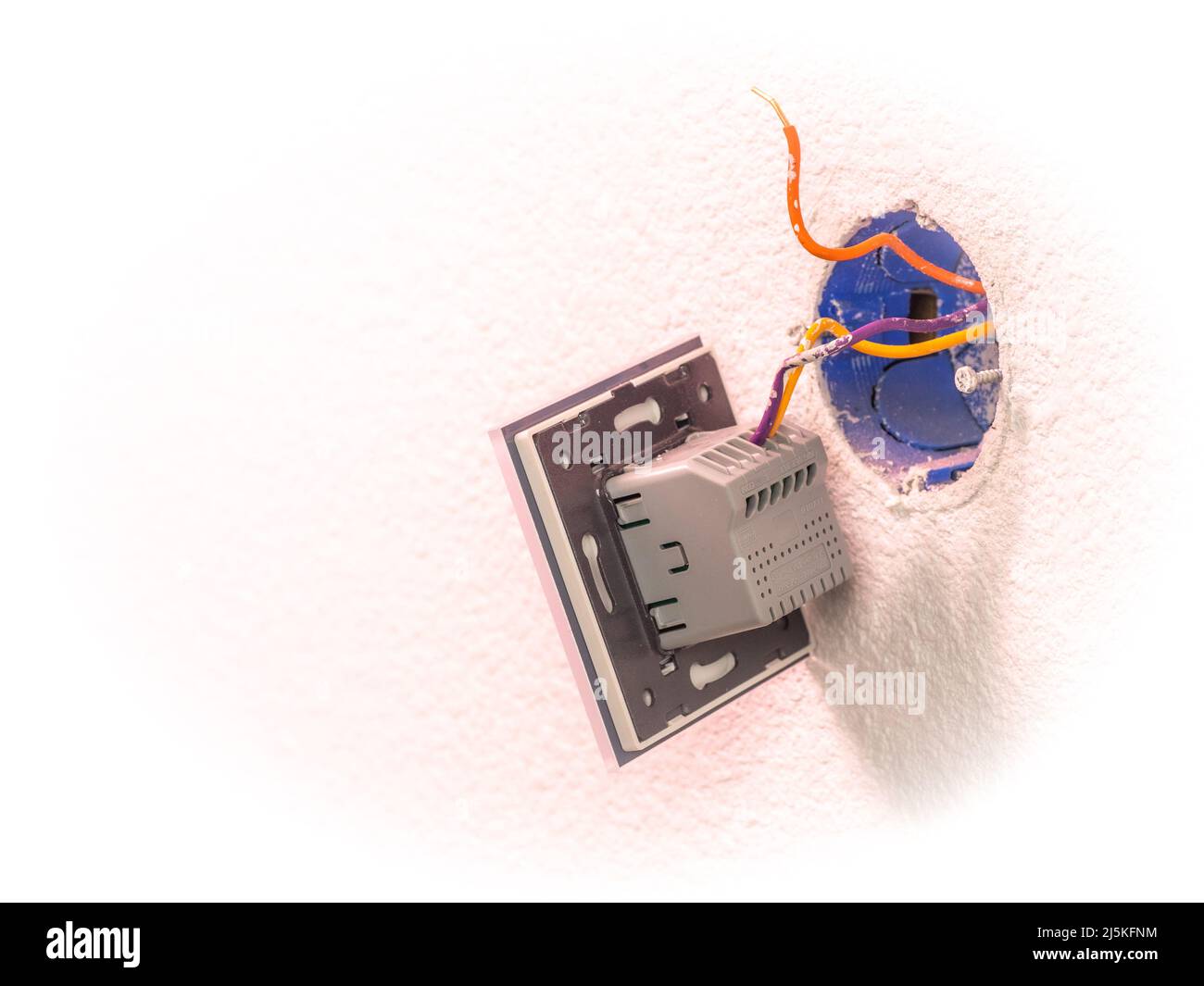 caen, France, April 2022. Touch light switch - socket assembly ...