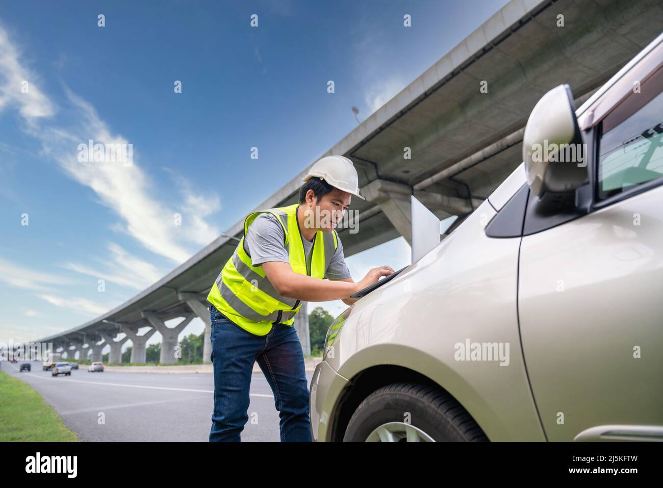 A Civil Engineers use laptop working inspection project road ...