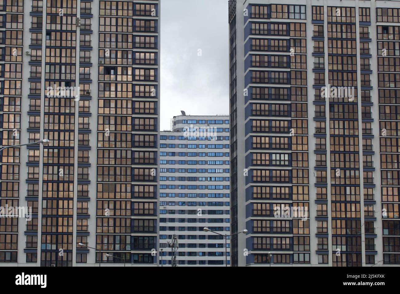 Construction of multi-storey buildings. Modern multi-storey building. Houses built of concrete ...