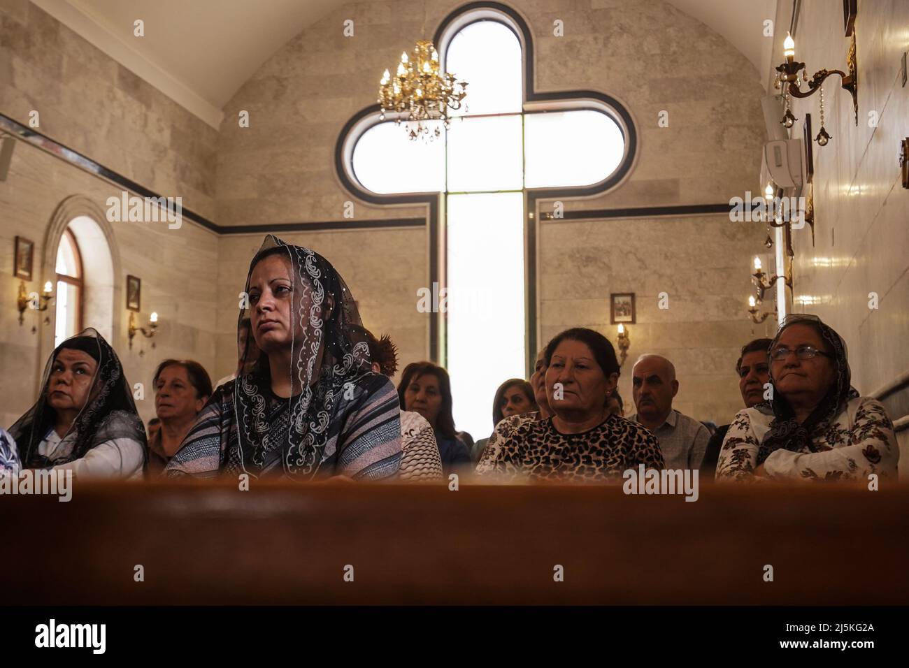 Mosul, Iraq. 24th Apr, 2022. Iraqi Christian worshippers attend the ...