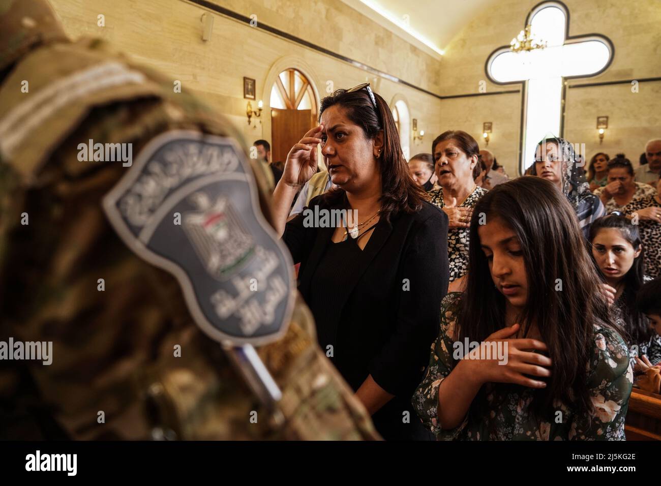 Mosul, Iraq. 24th Apr, 2022. Iraqi Christian worshippers attend the ...