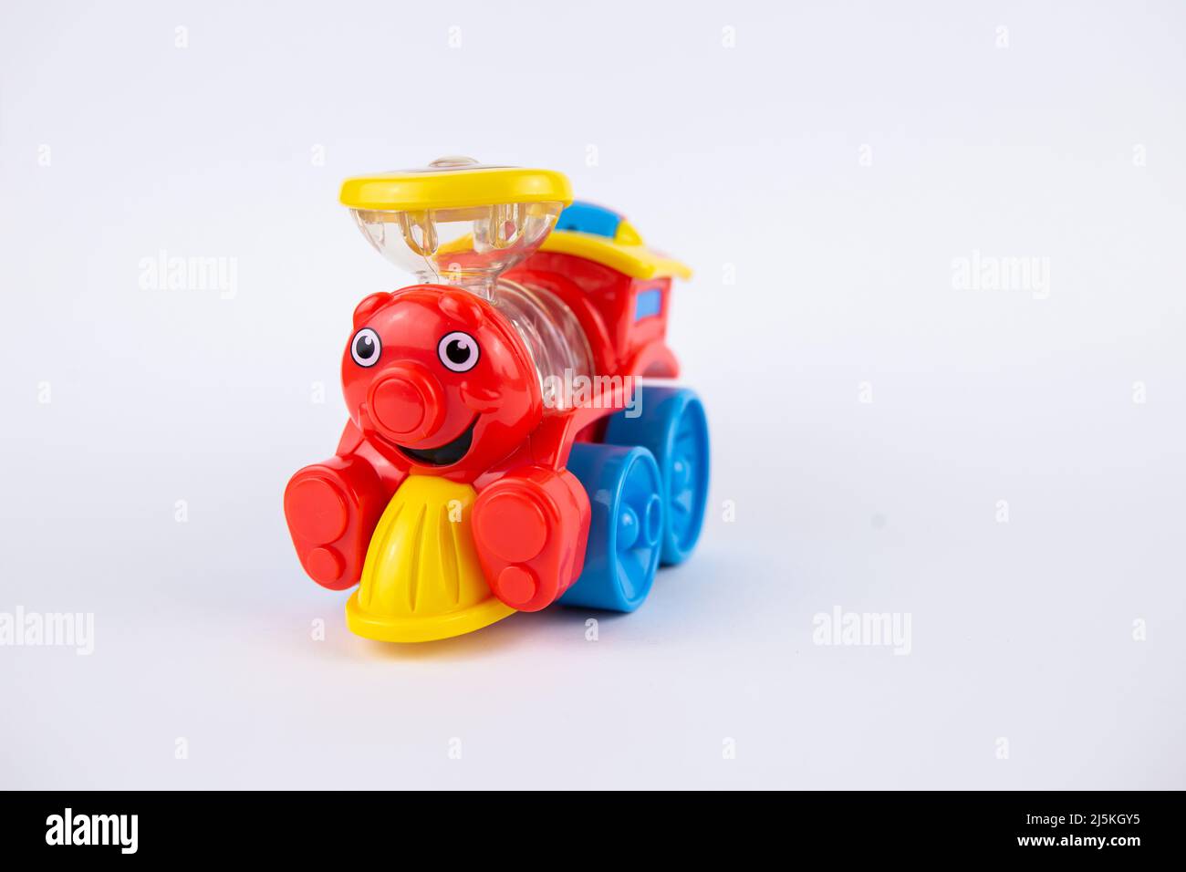 children's plastic toy steam locomotive on a white background Stock ...