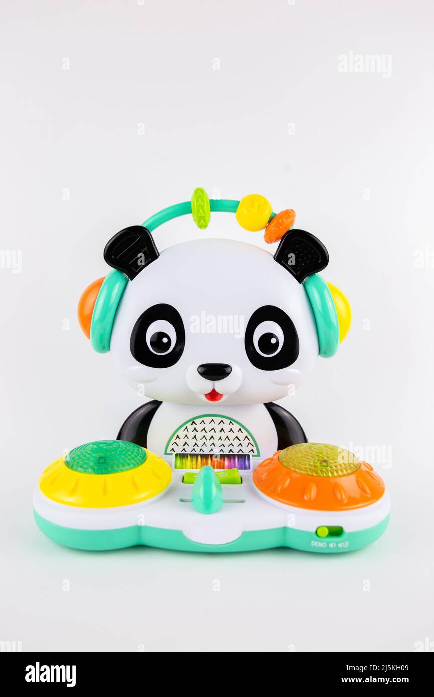 a children's toy plastic panda on a white background Stock Photo - Alamy
