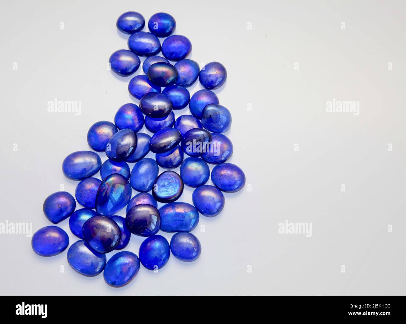 Blue glass bead patterns on white background April 2022 Stock Photo - Alamy