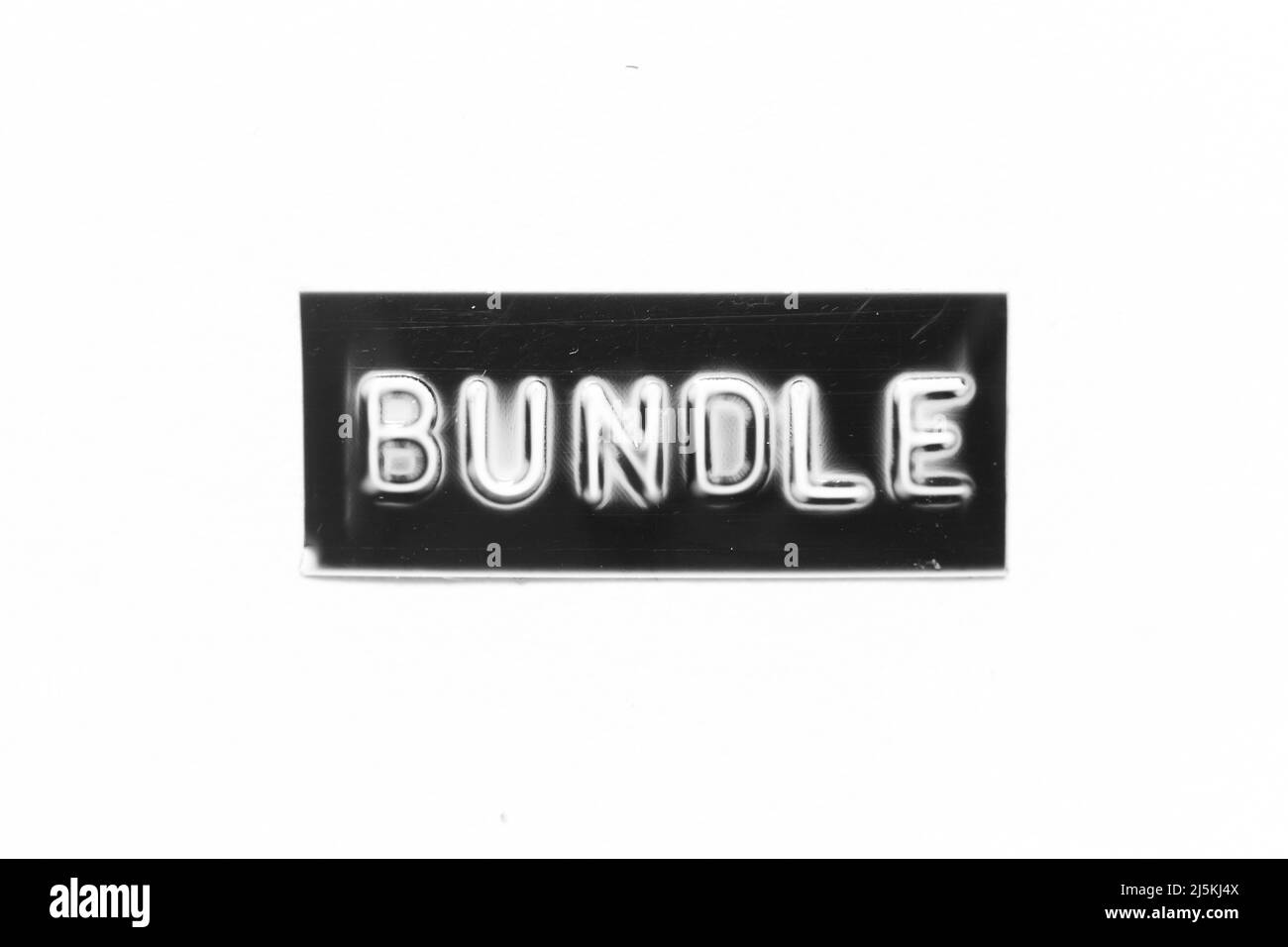 Black color banner that have embossed letter with word bundle on white ...